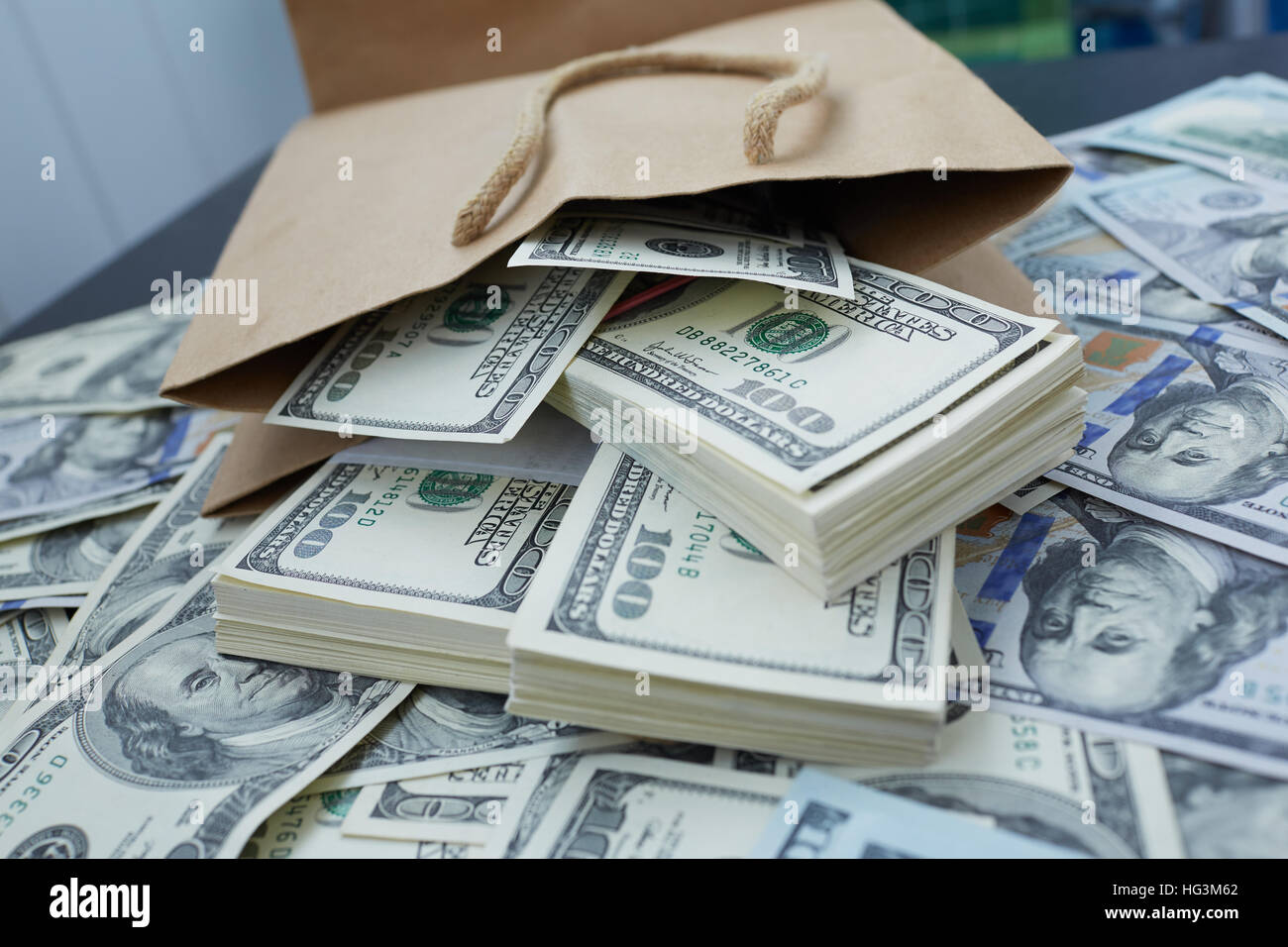 much money out of a paper bag Stock Photo - Alamy