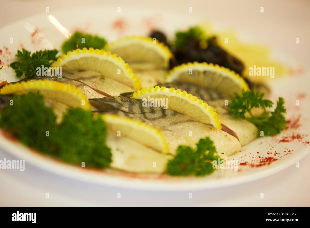 delicious appetizers with fish and lemon Stock Photo - Alamy