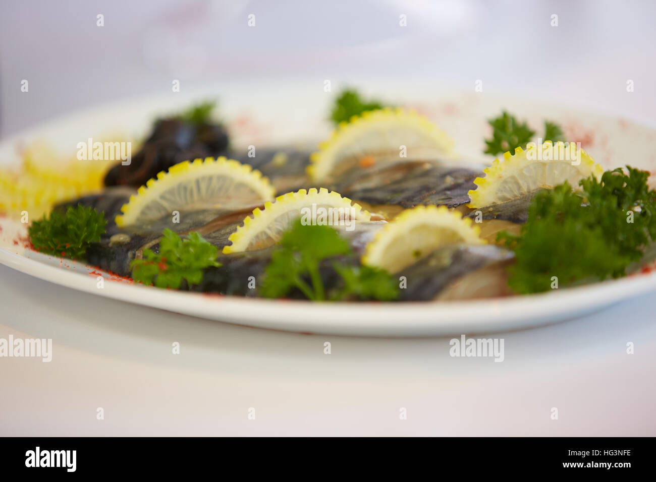 delicious appetizers with fish and lemon Stock Photo - Alamy