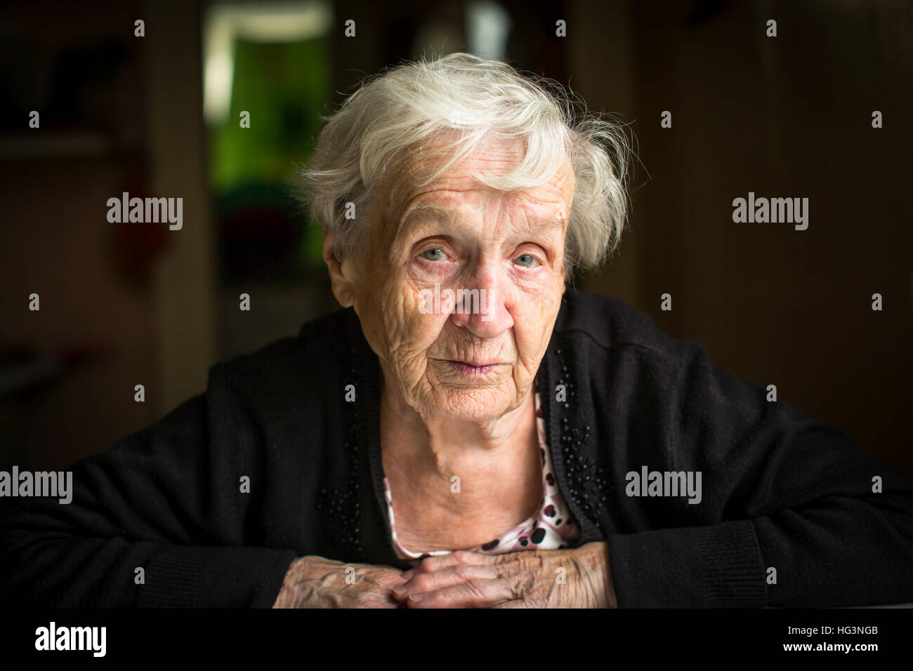 Pensioner woman chair window hi-res stock photography and images - Alamy