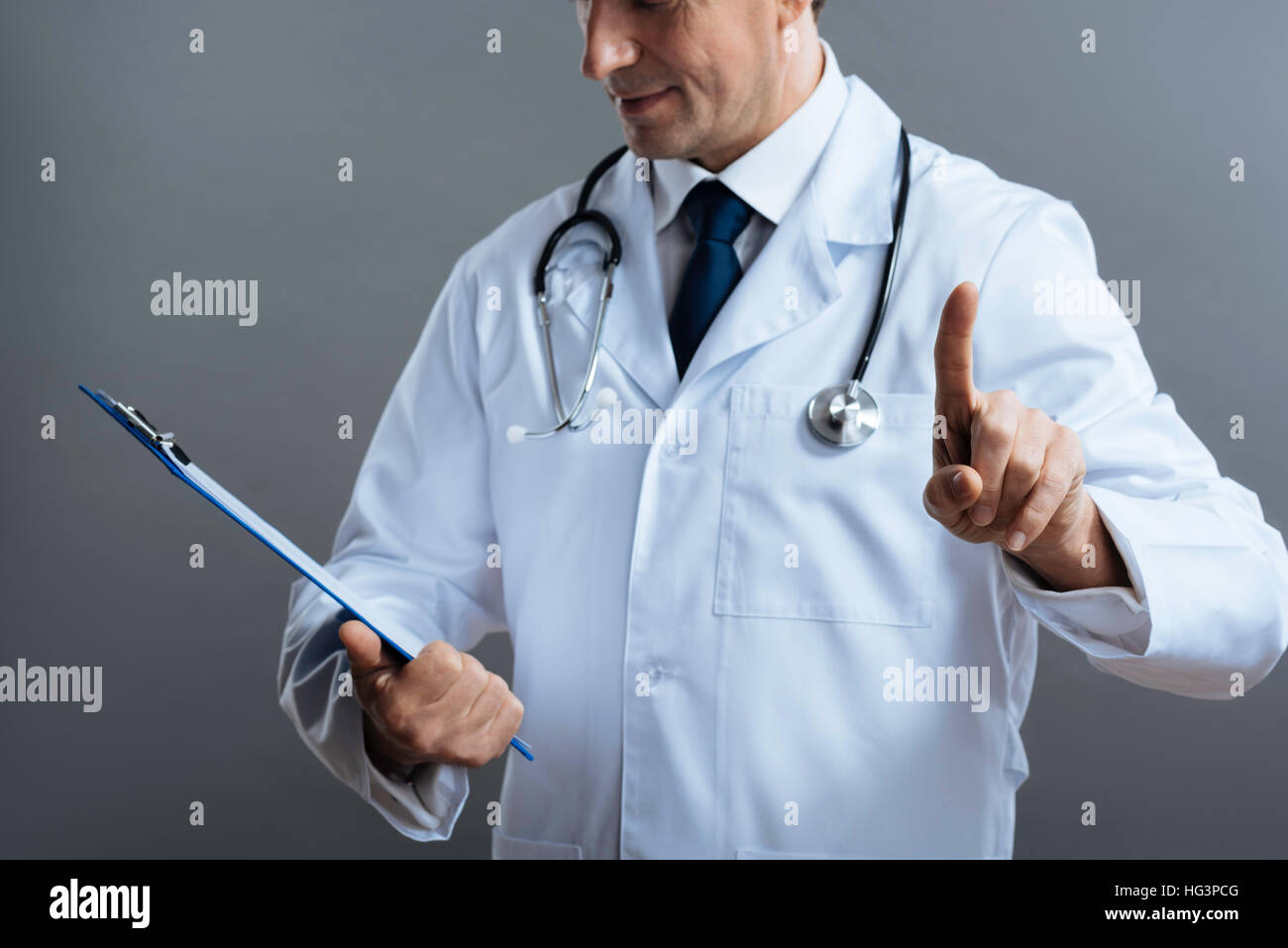 Close up of confident doctors hands holding documents Stock Photo - Alamy