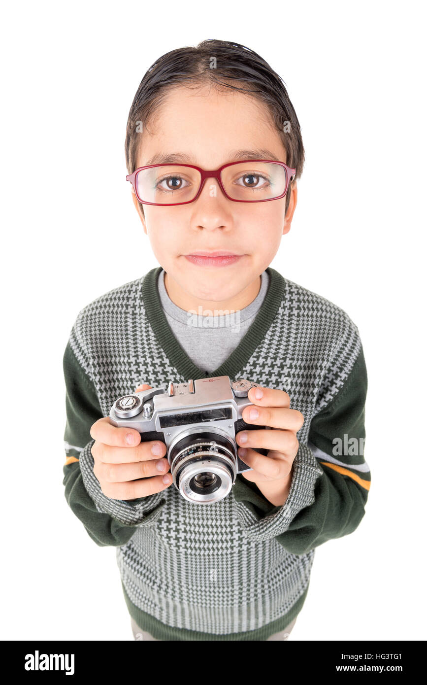Kid with an old camera isolated in white making faces Stock Photo - Alamy