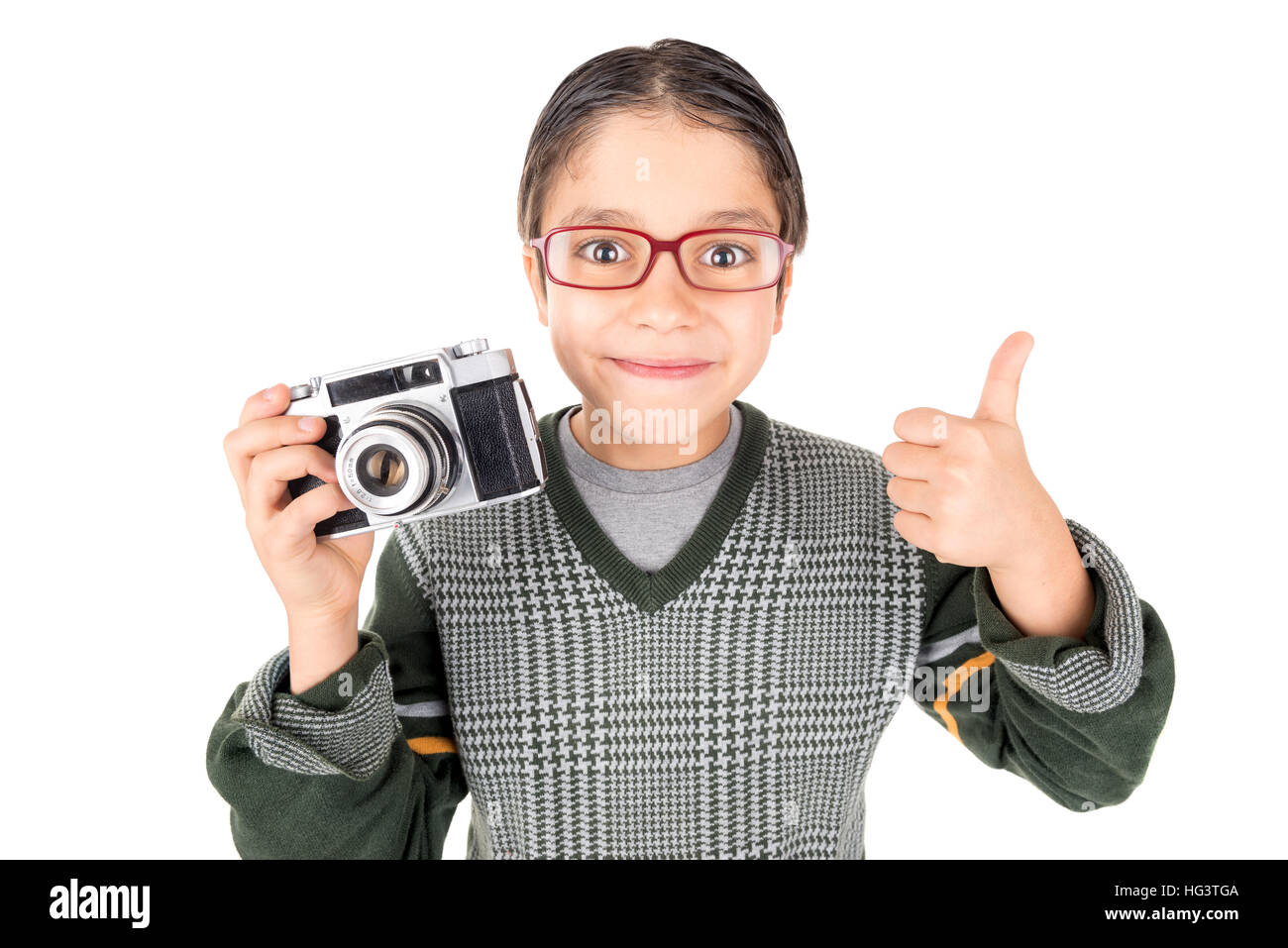 Kid with an old camera isolated in white making faces Stock Photo - Alamy