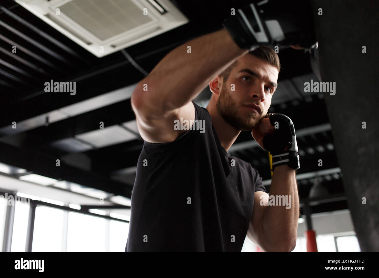 Man exercising boxing in gloves Stock Photo - Alamy