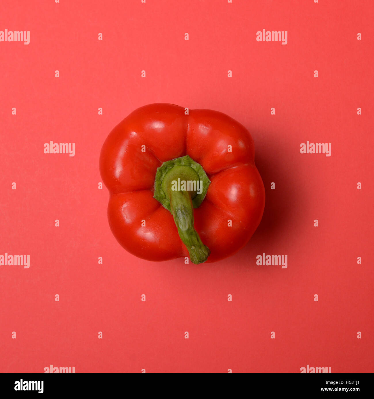 Fresh red paprika on red backround - Top view Stock Photo - Alamy