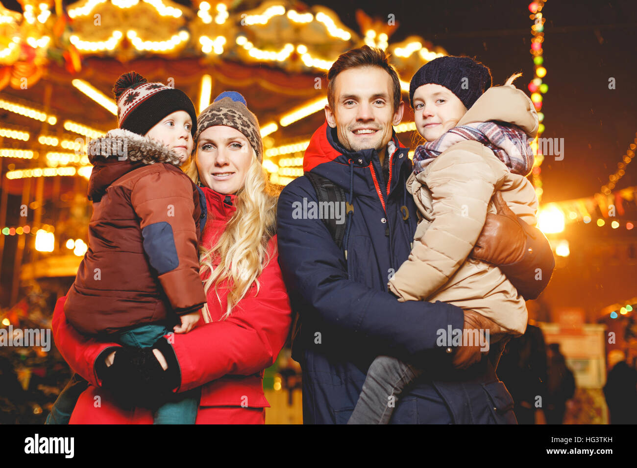 Family with children in arms Stock Photo - Alamy