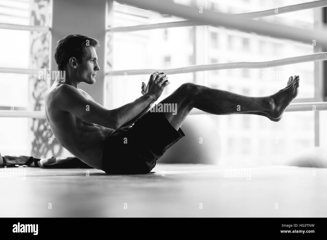 Young man training in gym Stock Photo - Alamy