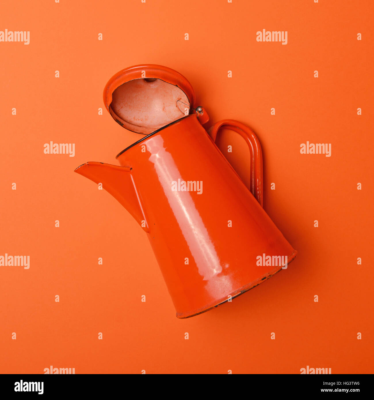 Retro orange tea pot on orange background - Minimalism Stock Photo - Alamy