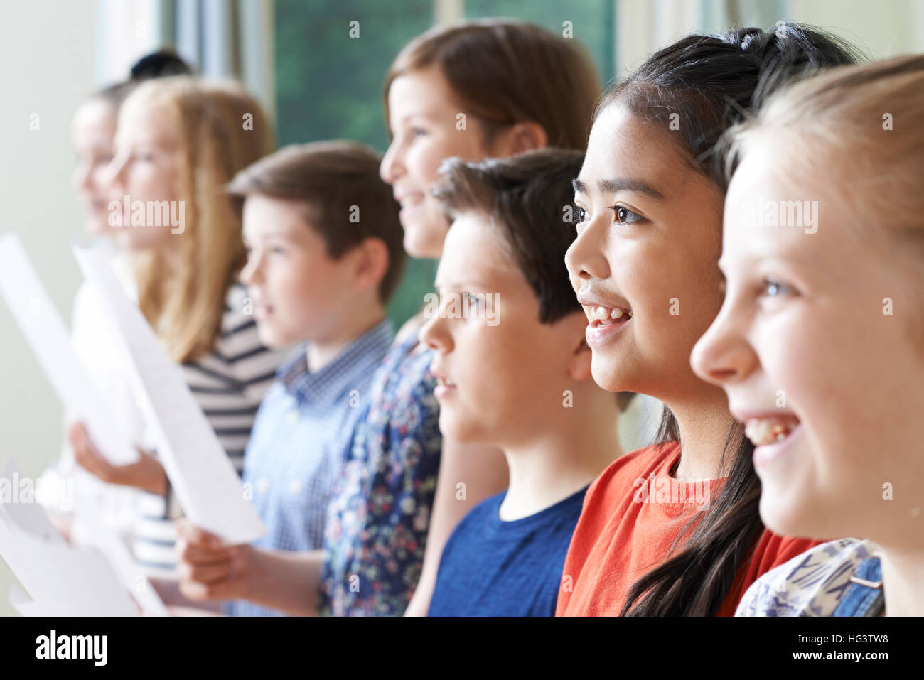 Group Of Children Enjoying Singing Group Stock Photo - Alamy