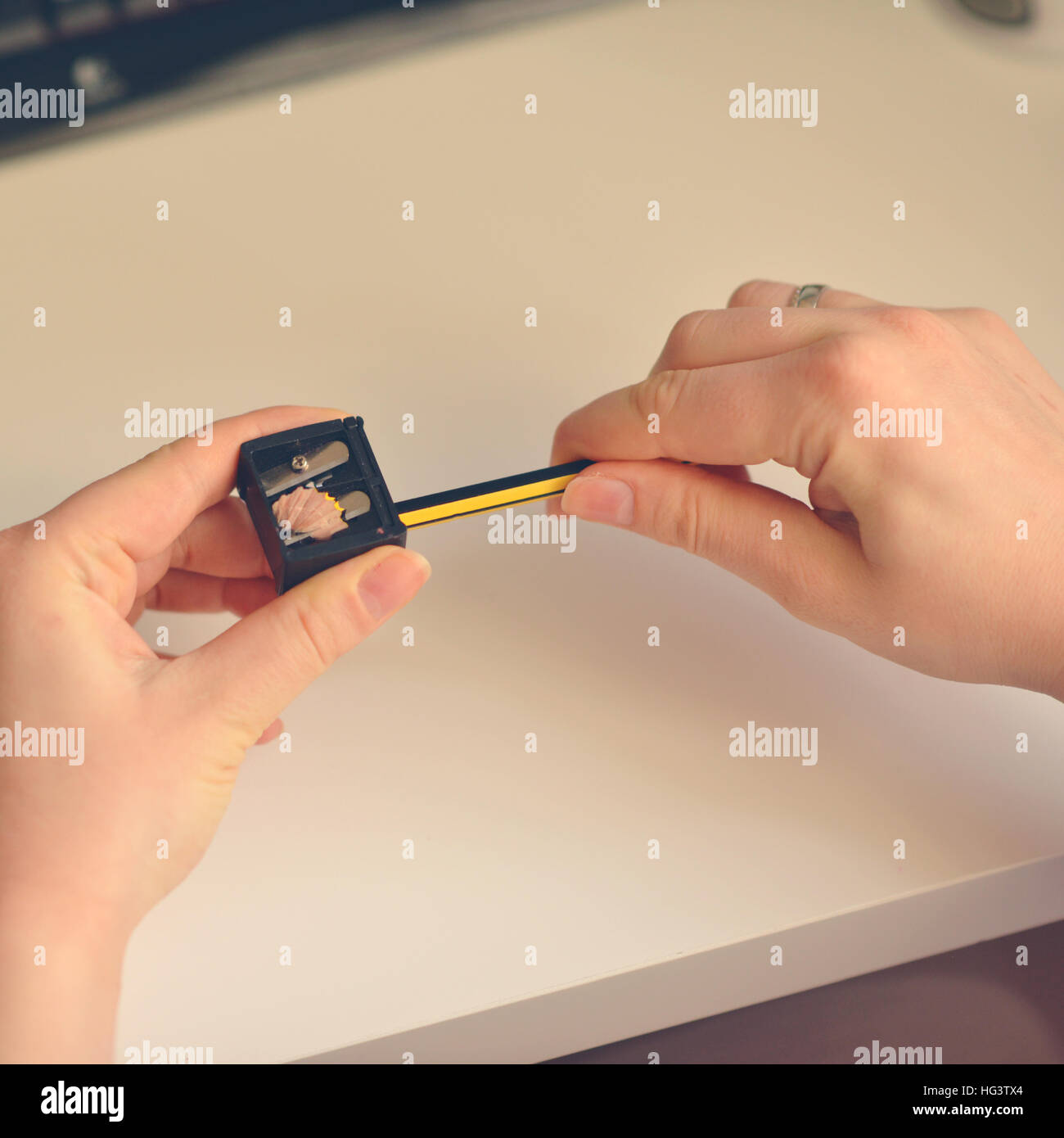 Hand sharpening pencil Stock Photo - Alamy