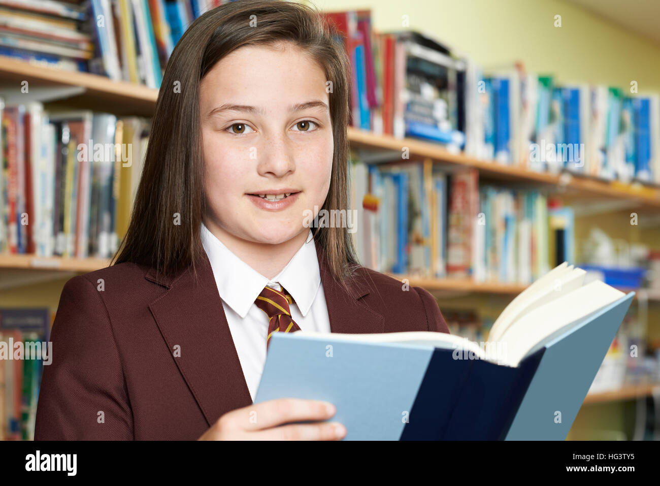 Wearing uniform in library reading hi-res stock photography and images ...