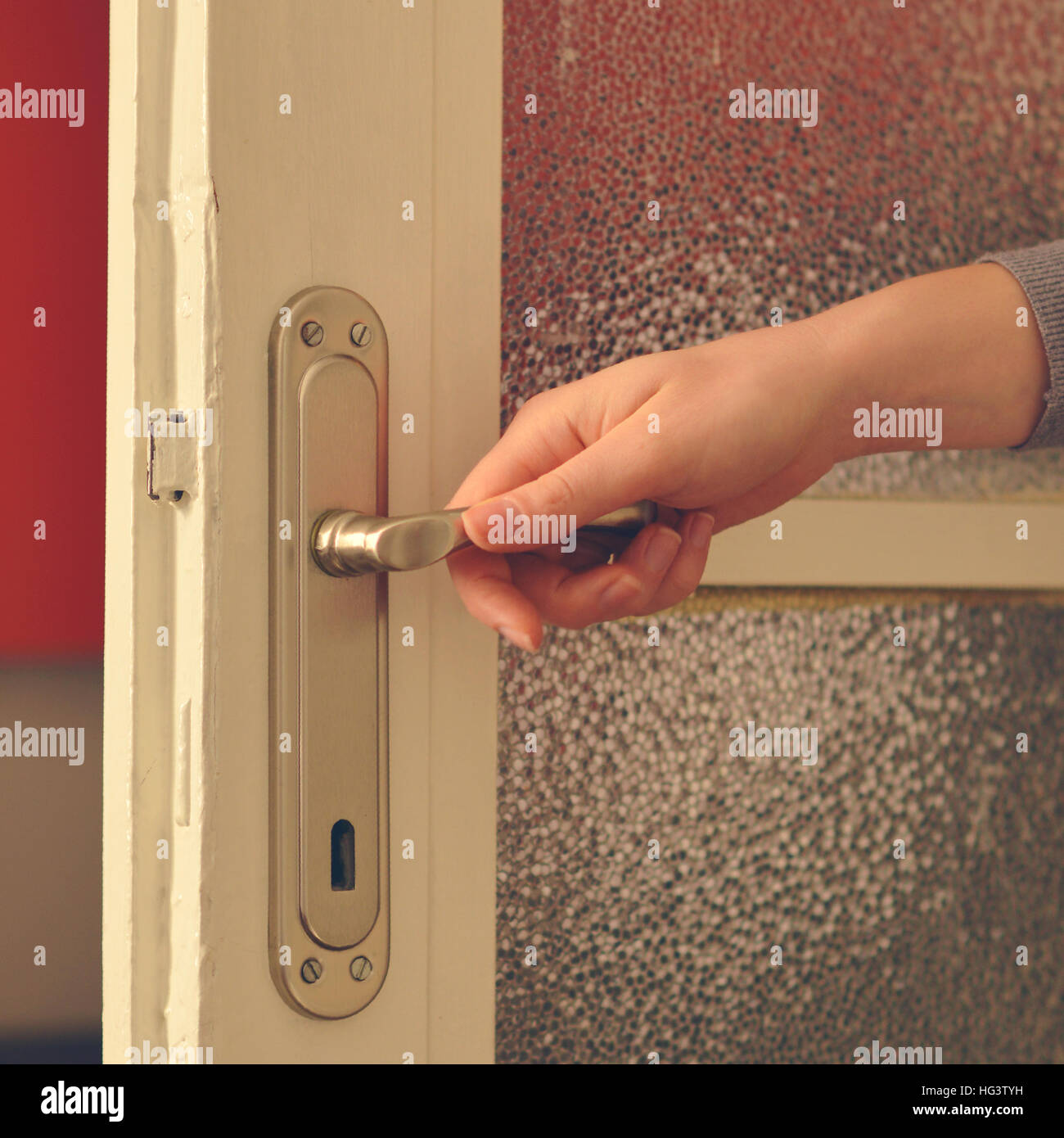 Woman hands closing r opening door Stock Photo - Alamy