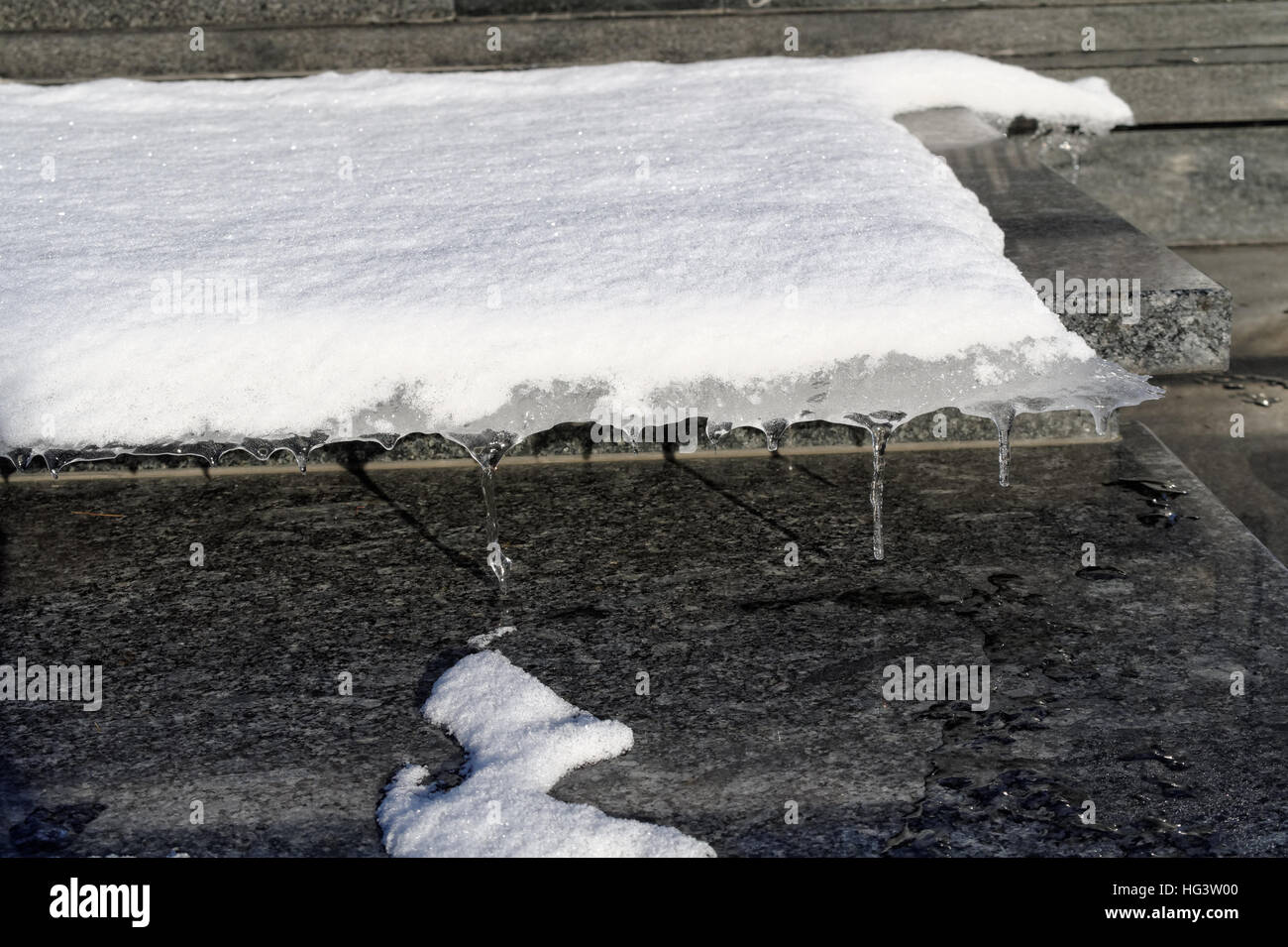 closeup of the melting snow on the black marble Stock Photo - Alamy