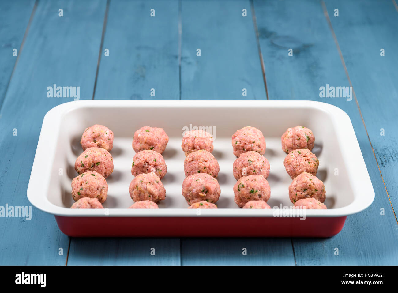Preparing Raw Meatballs In Pan Stock Photo - Alamy