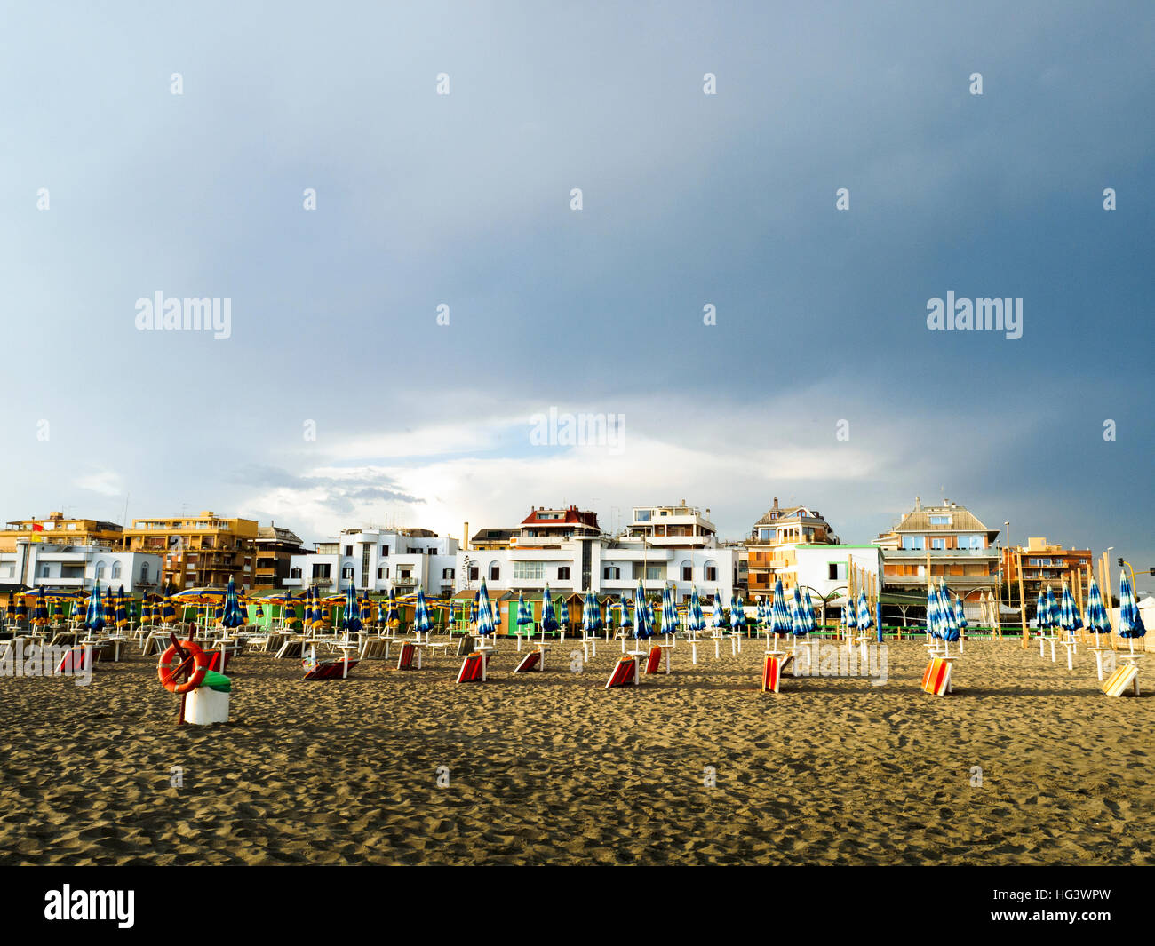 beach umbrella and deckchair - Ostia Lido - Rome, Italy Stock Photo - Alamy