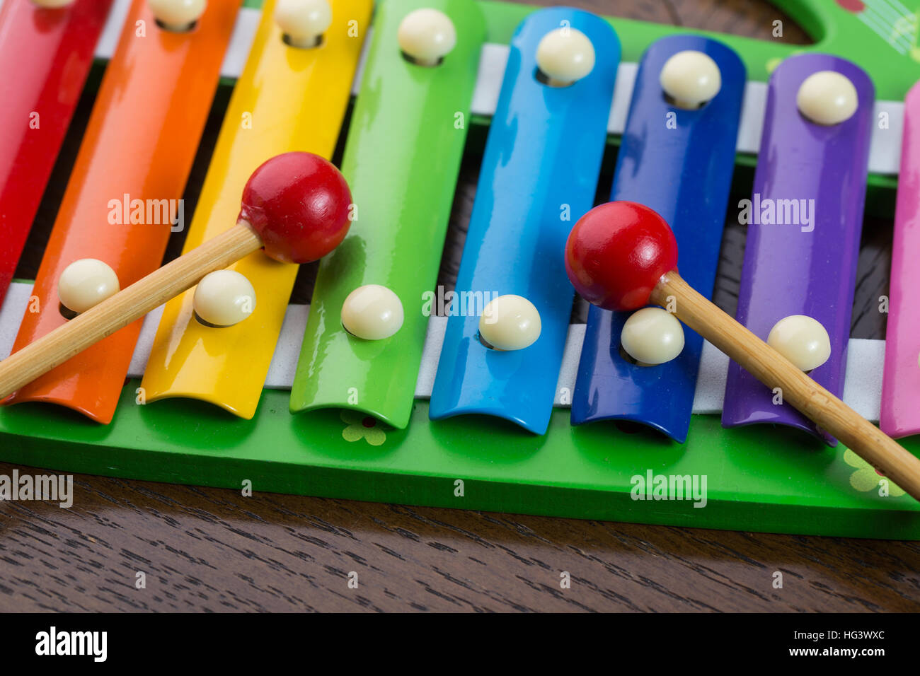 Rainbow colored toy xylophone Stock Photo - Alamy