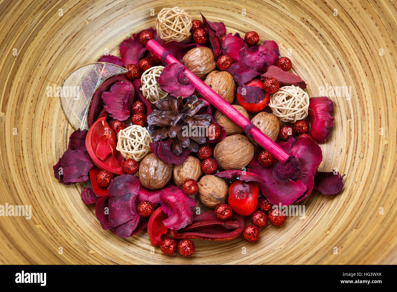 Natural colored decoration of nuts in wooden bowl Stock Photo - Alamy