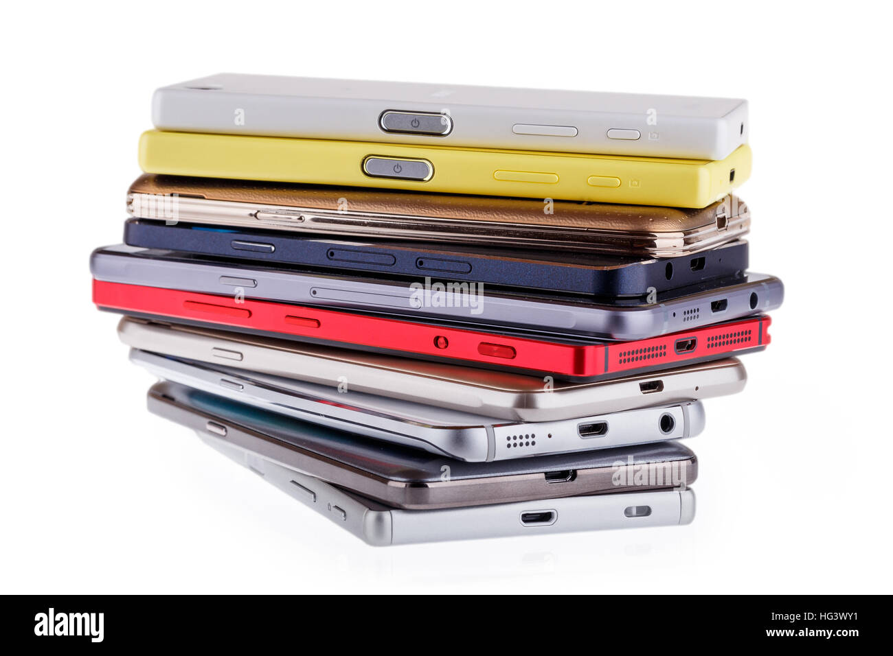 Pile of mobile phone. Heap of the different smartphones isolated on ...