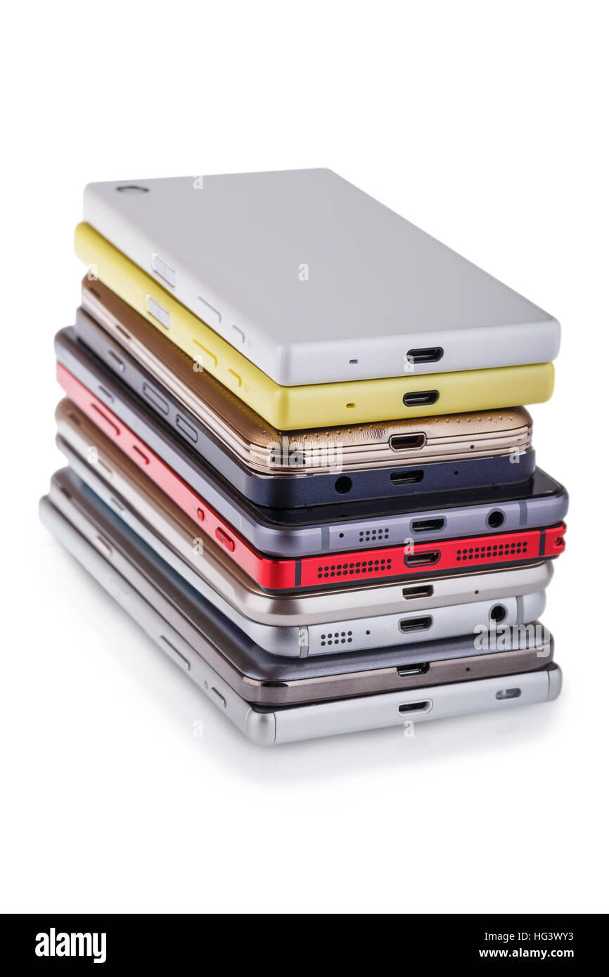 Pile of mobile phone. Heap of the different smartphones isolated on ...