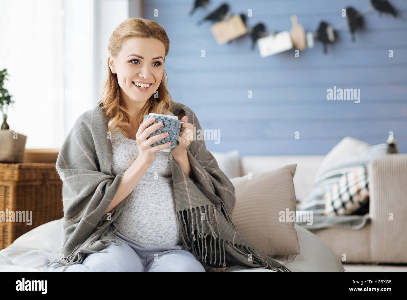 Pregnant woman drinking tea in bedroom Stock Photo - Alamy