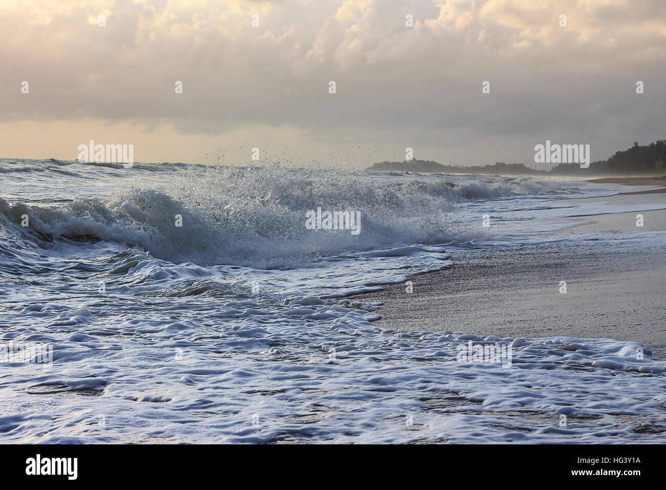 Waves and wind, the rain and the morning sunrise Stock Photo - Alamy