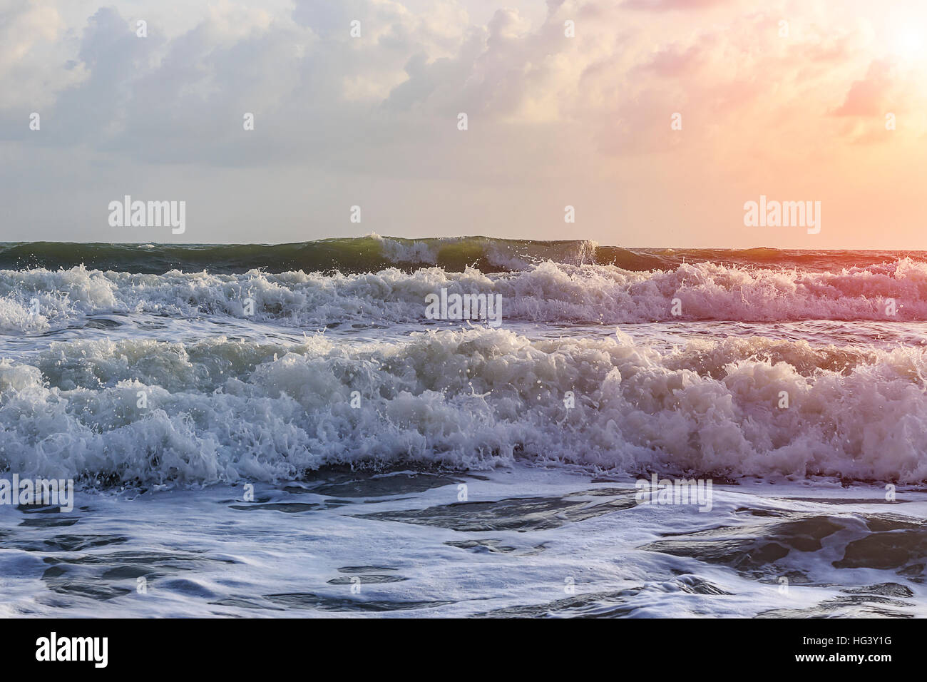 Wind, waves and rains sunset Stock Photo - Alamy