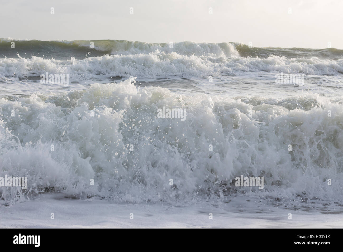 Waves and wind, the rain and the morning sunrise Stock Photo - Alamy