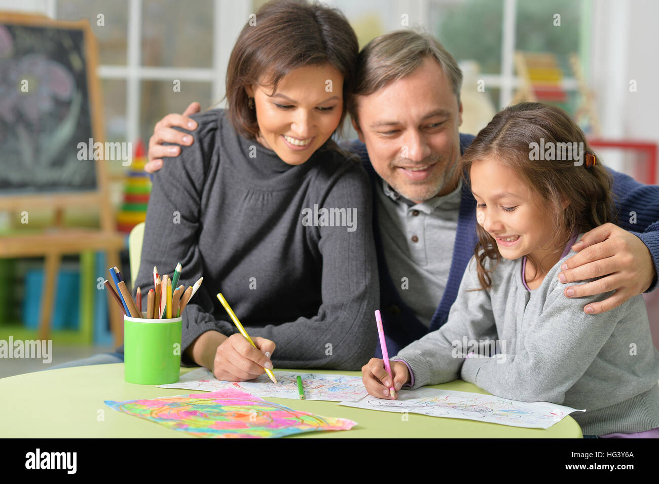 Family drawing together Stock Photo - Alamy