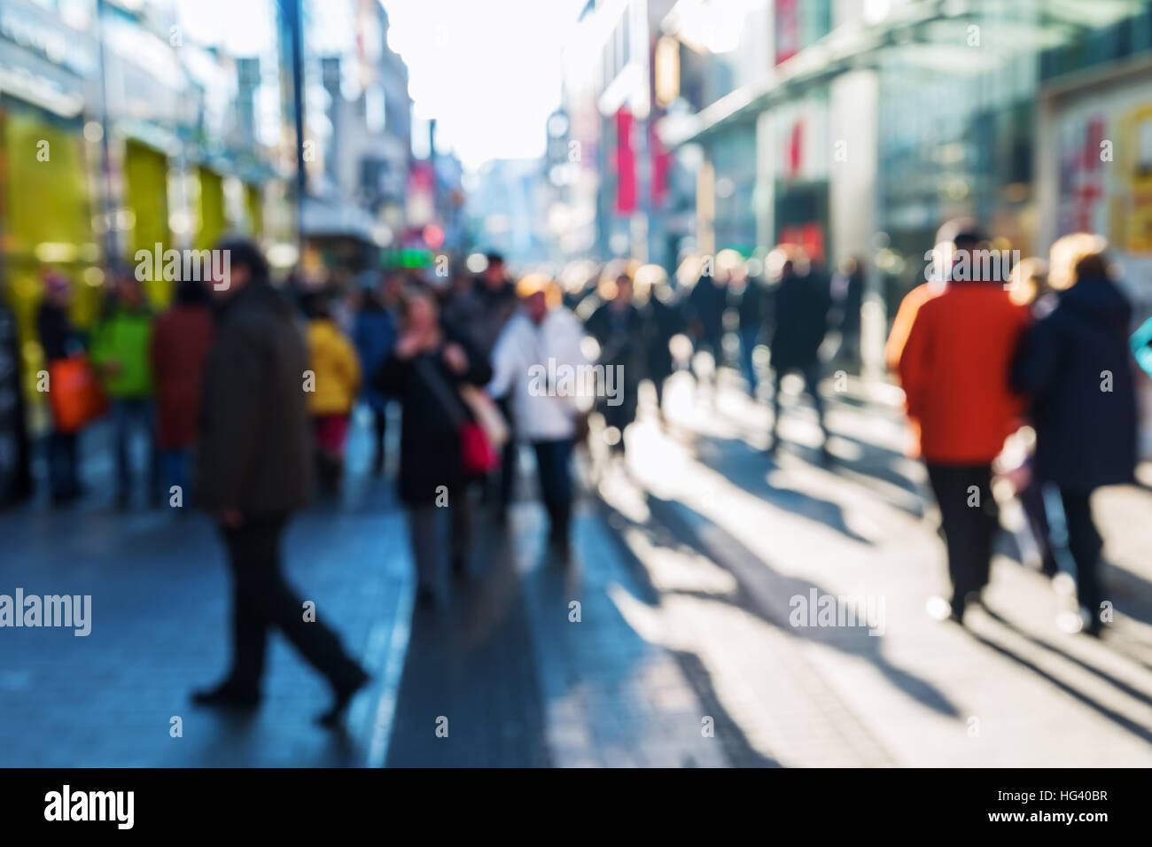 crowd of people on a shopping street in out of focus view Stock Photo ...
