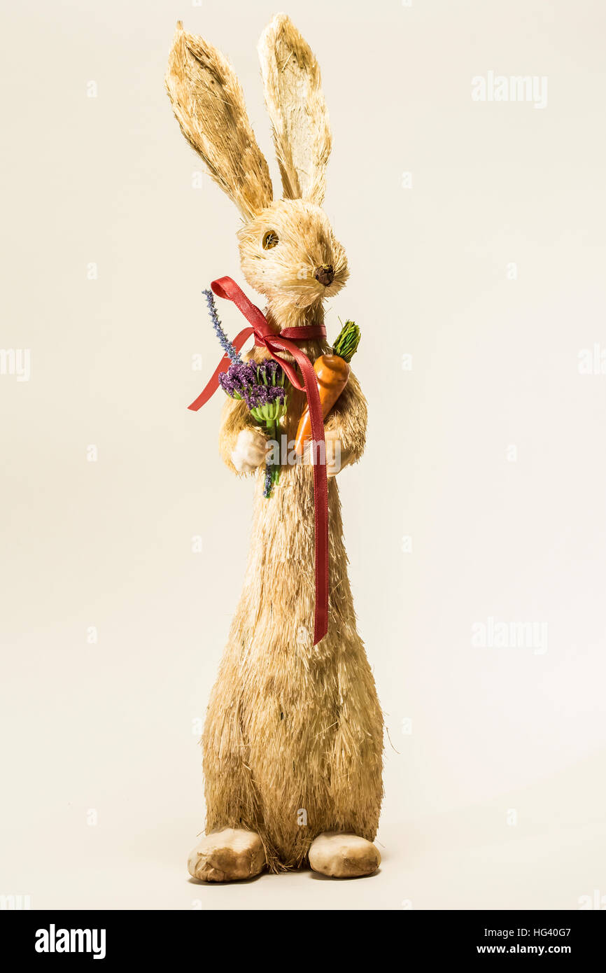 straw easter bunny with carrot and flowers and ribbon Stock Photo - Alamy