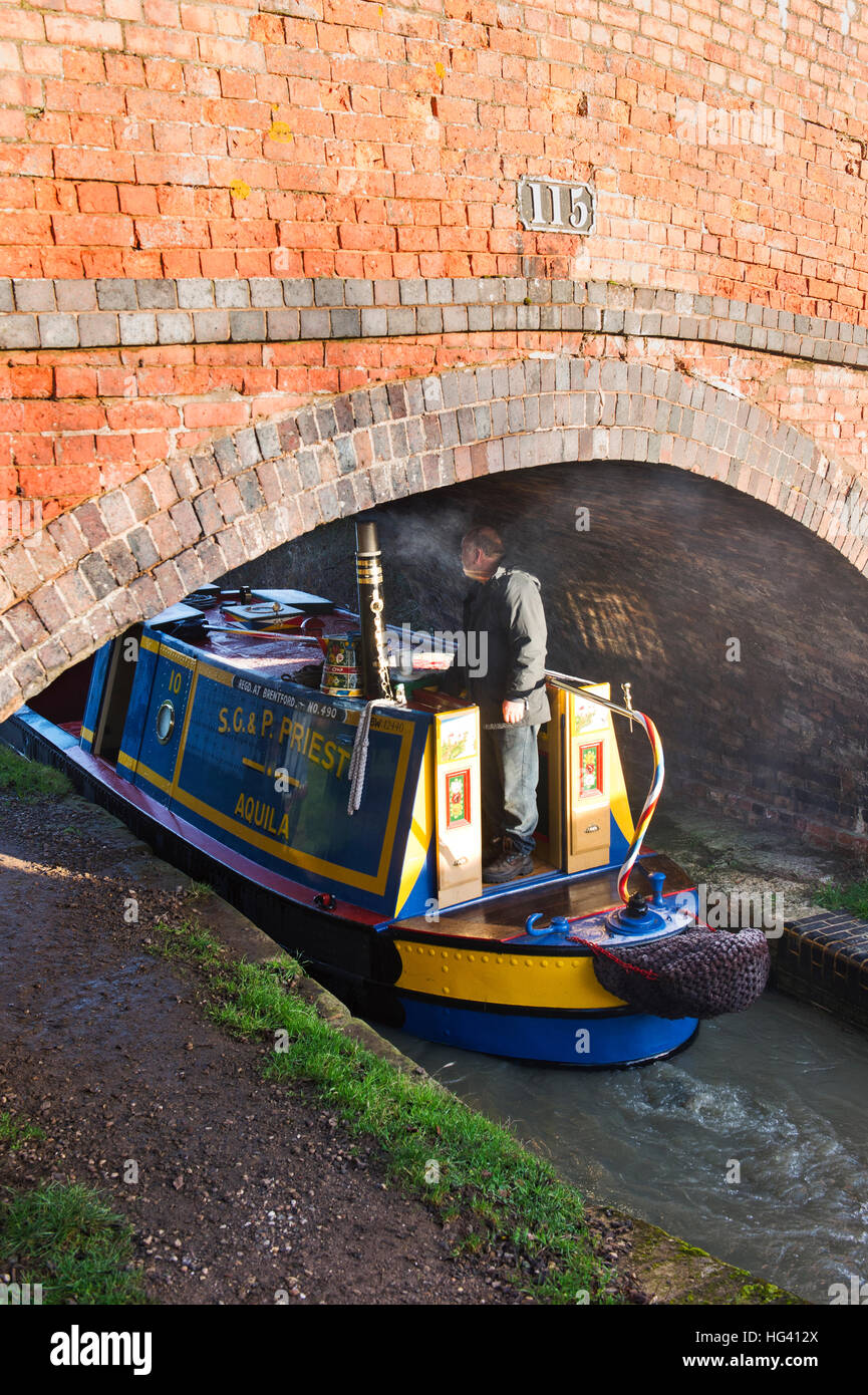 Narrow boats passing under bridge on canal hi-res stock photography and ...