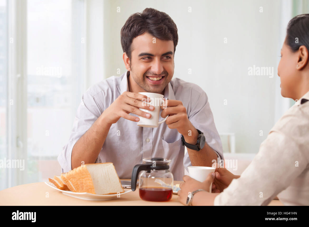 Indian man eating breakfast hi-res stock photography and images - Alamy