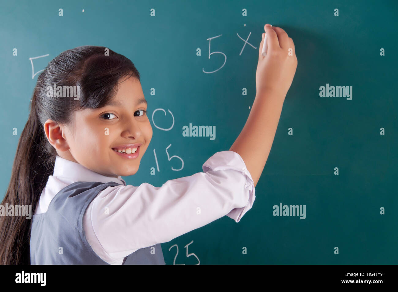 Children writing on blackboard hi-res stock photography and images - Alamy