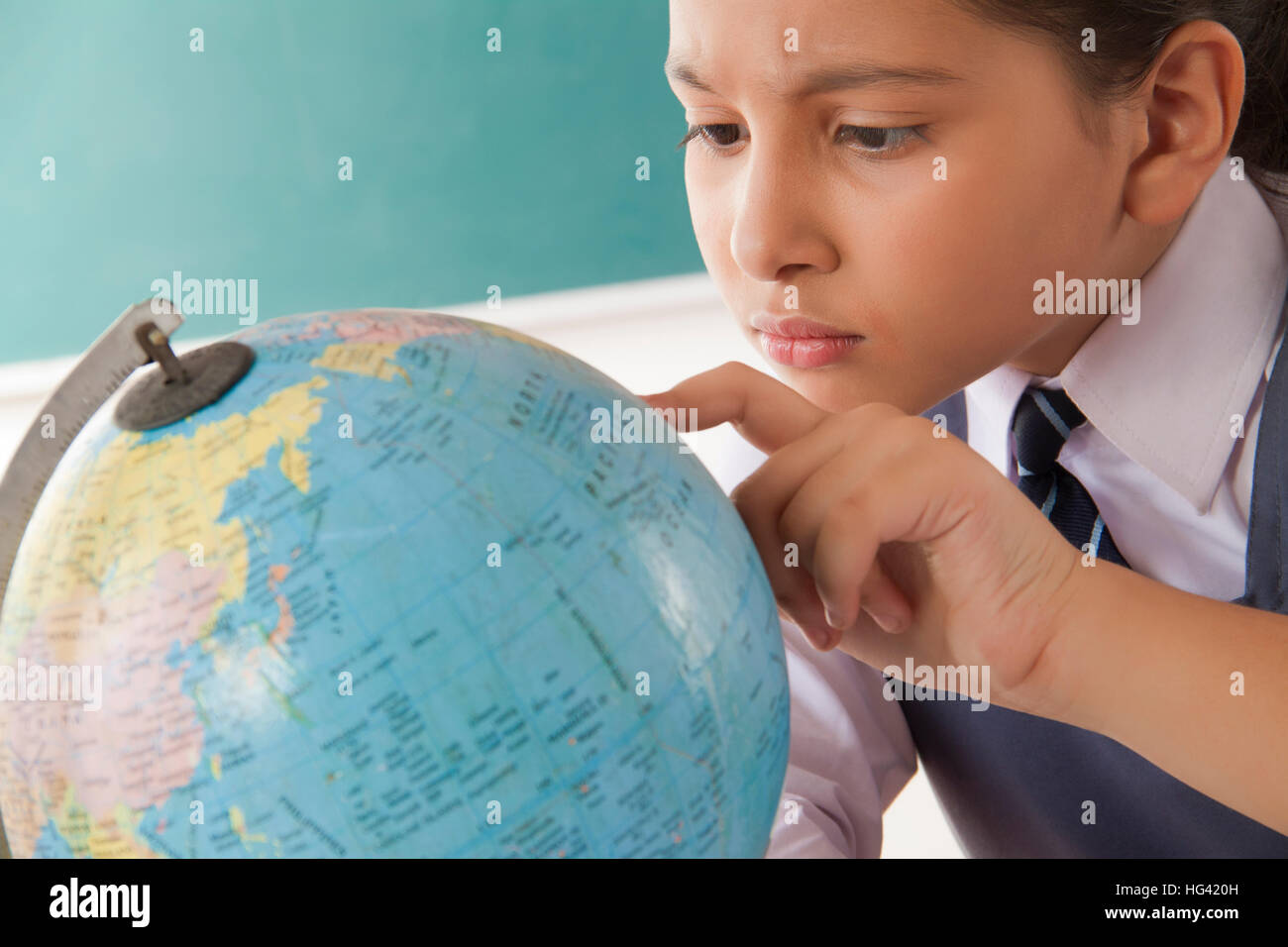 Indian school girl holding map hi-res stock photography and images - Alamy