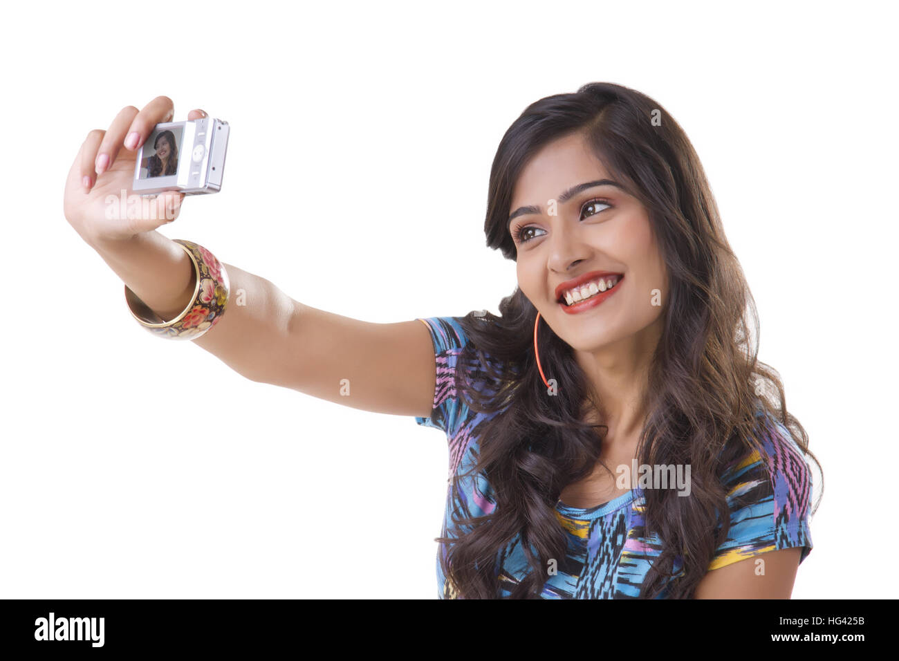 Young woman taking self photo with camera Stock Photo - Alamy