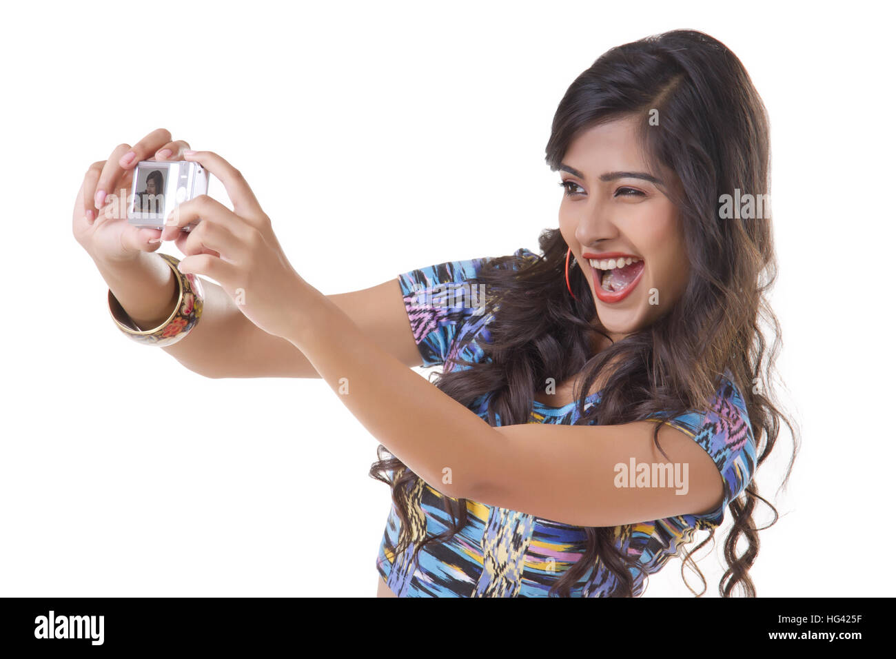 Young woman taking self photo with camera Stock Photo - Alamy