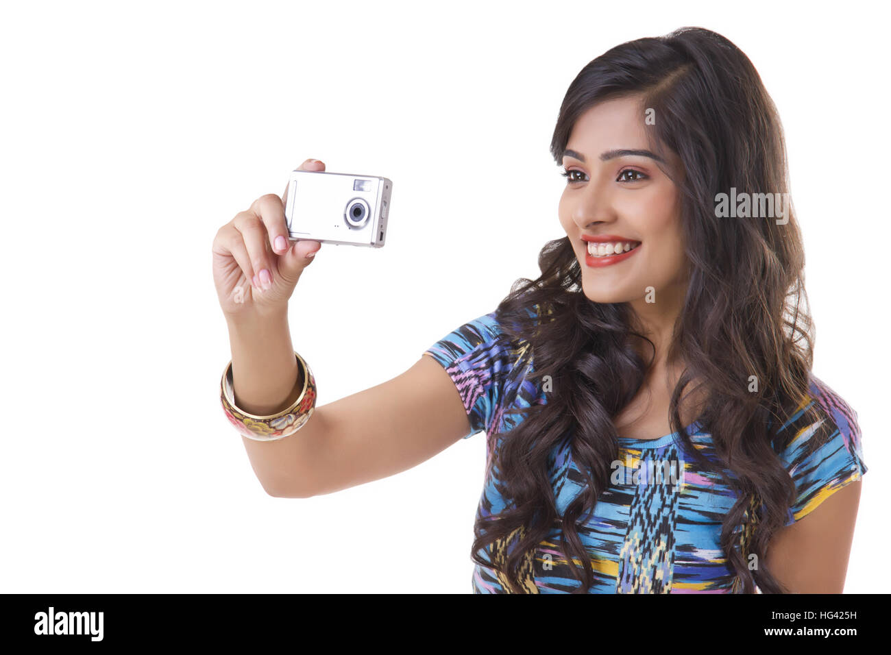 Young woman taking self photo with camera Stock Photo - Alamy