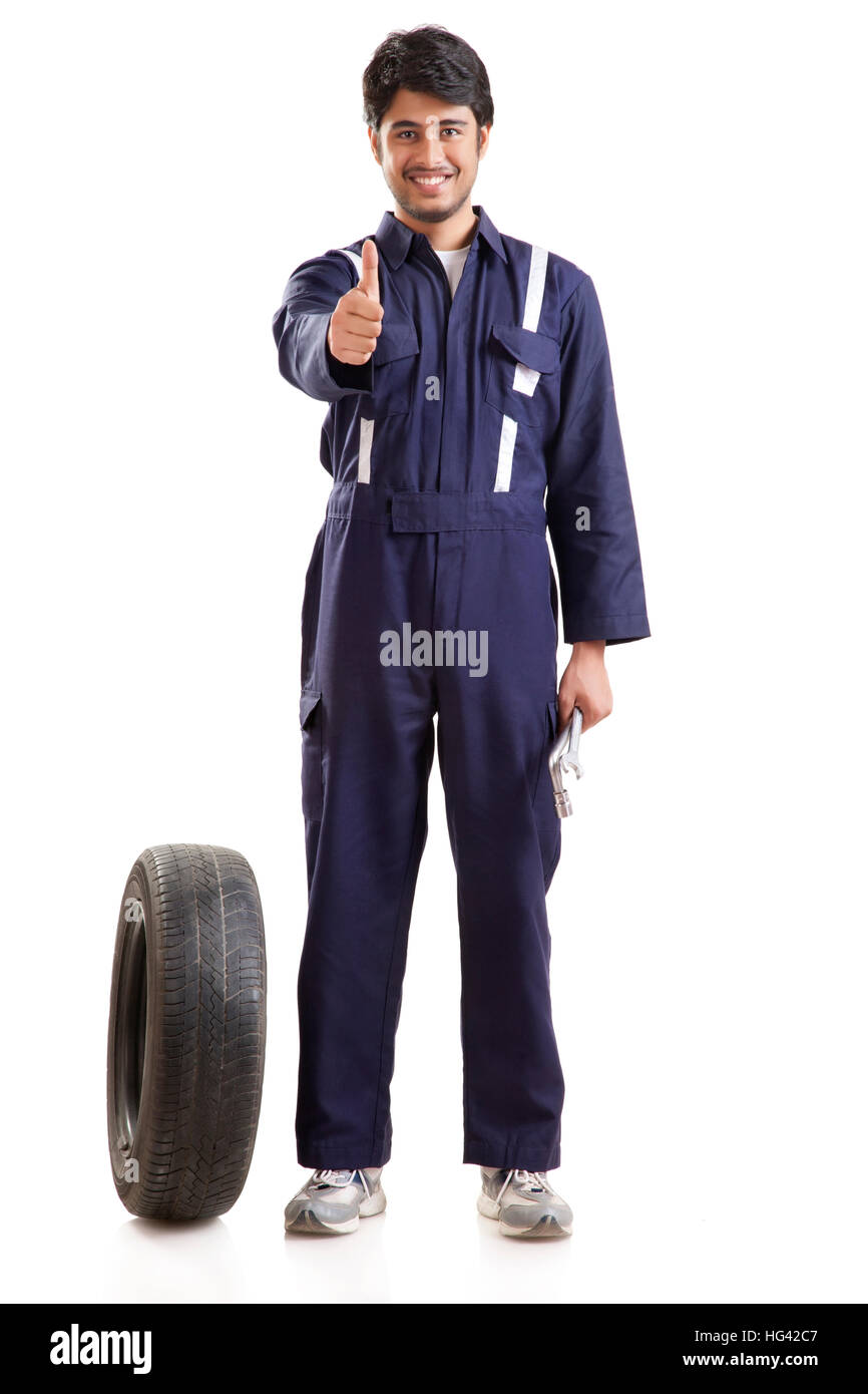 Portrait of car mechanic showing thumbs up Stock Photo - Alamy