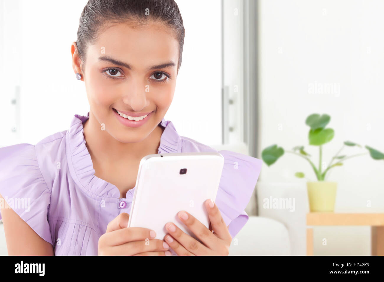 happy Teenage Girls looking at new tablet Stock Photo - Alamy
