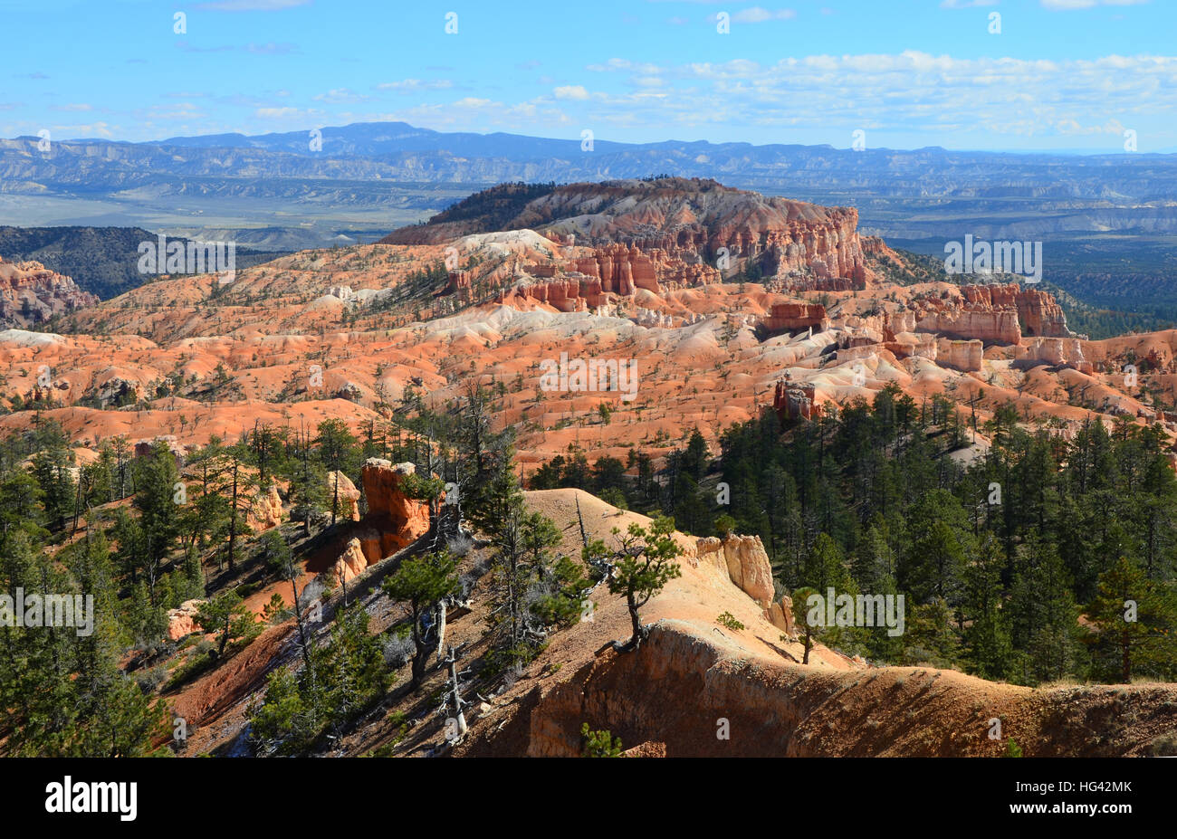 Hill with sand rock formations in Bryce Canyon with valley in ...