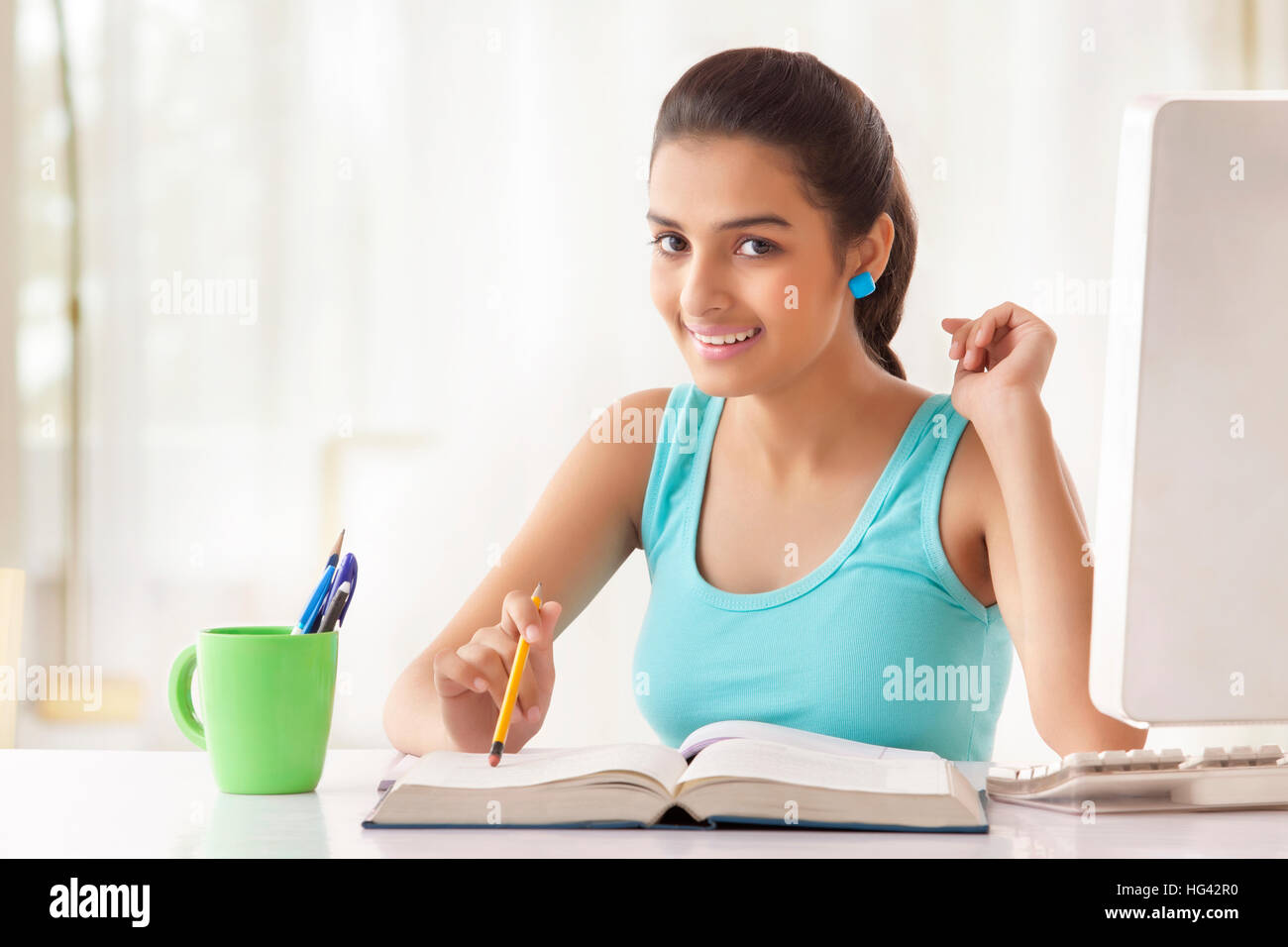 Portrait of Teenage Girls student studying at the table Stock Photo - Alamy
