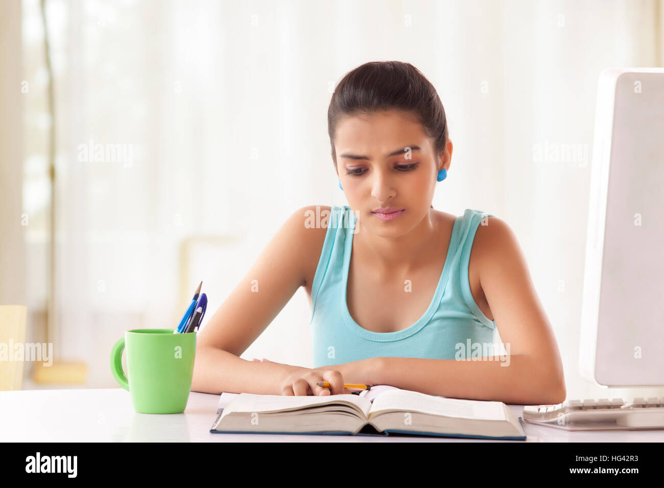 Portrait of Teenage Girls student studying at the table Stock Photo - Alamy