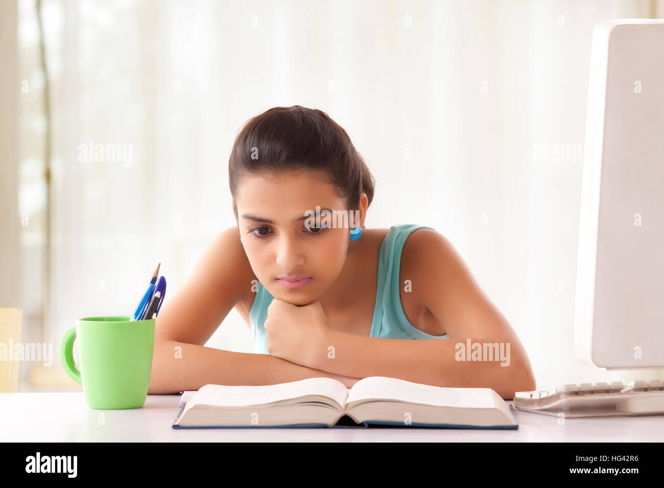 Portrait of Teenage Girls student studying at the table Stock Photo - Alamy