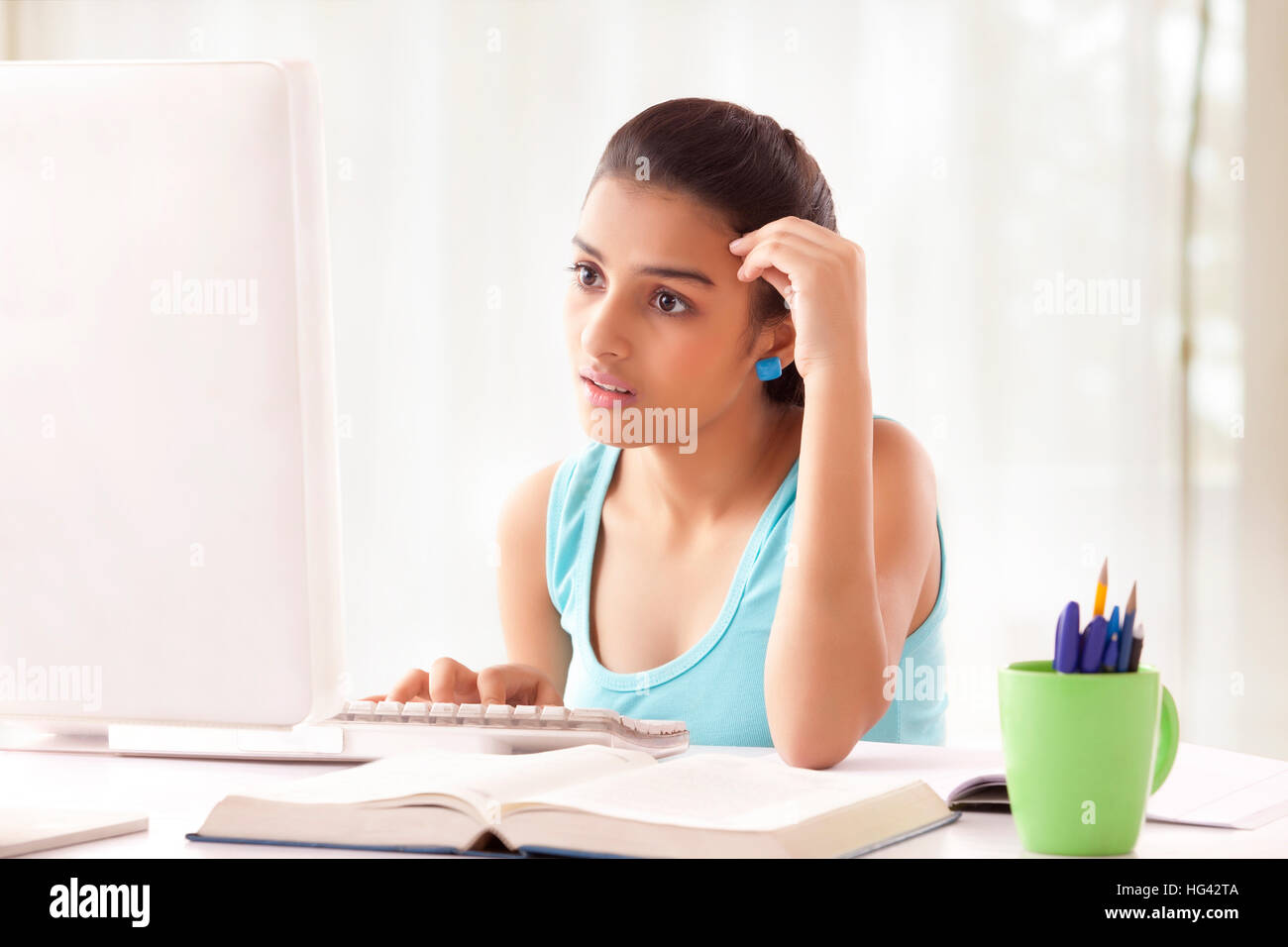 Teenage Girls using computer at home Stock Photo - Alamy