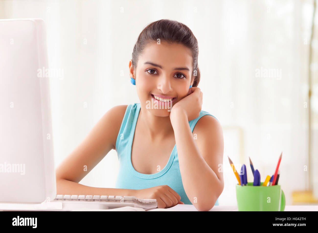 Teenage Girls using computer at home Stock Photo - Alamy
