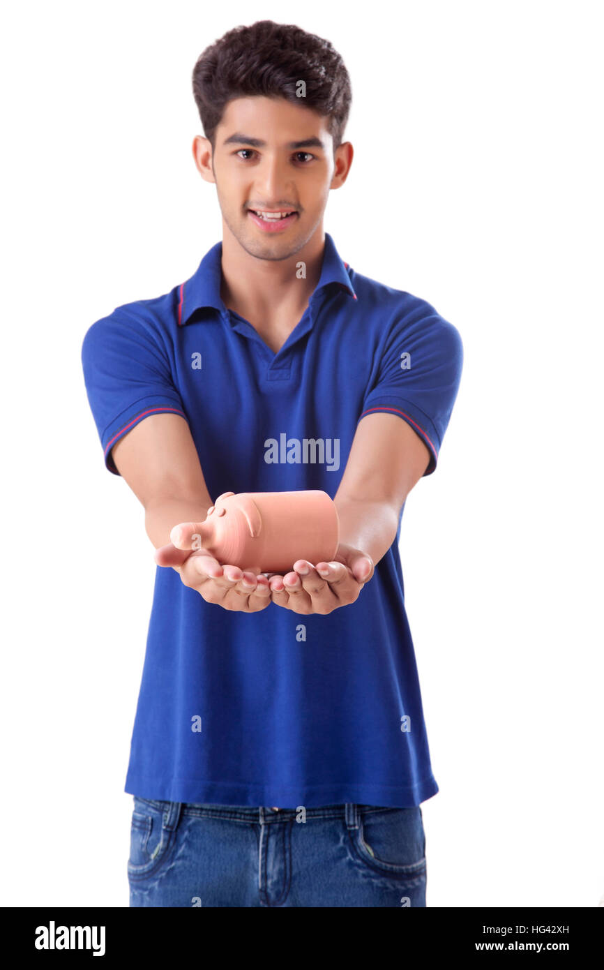 young college student holding a small piggy bank Stock Photo - Alamy