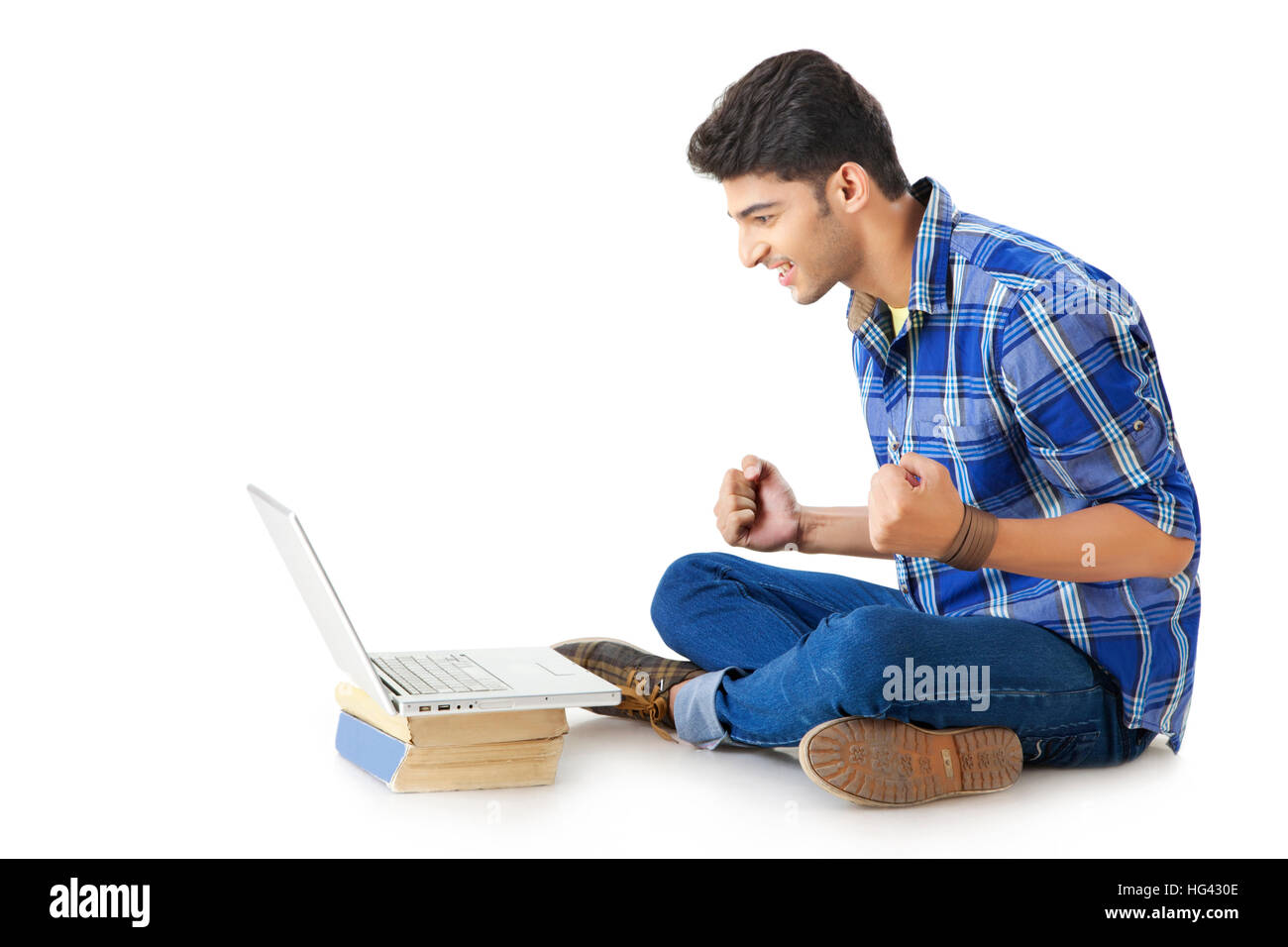 A happy young men sitting on the floor with his laptop Stock Photo - Alamy