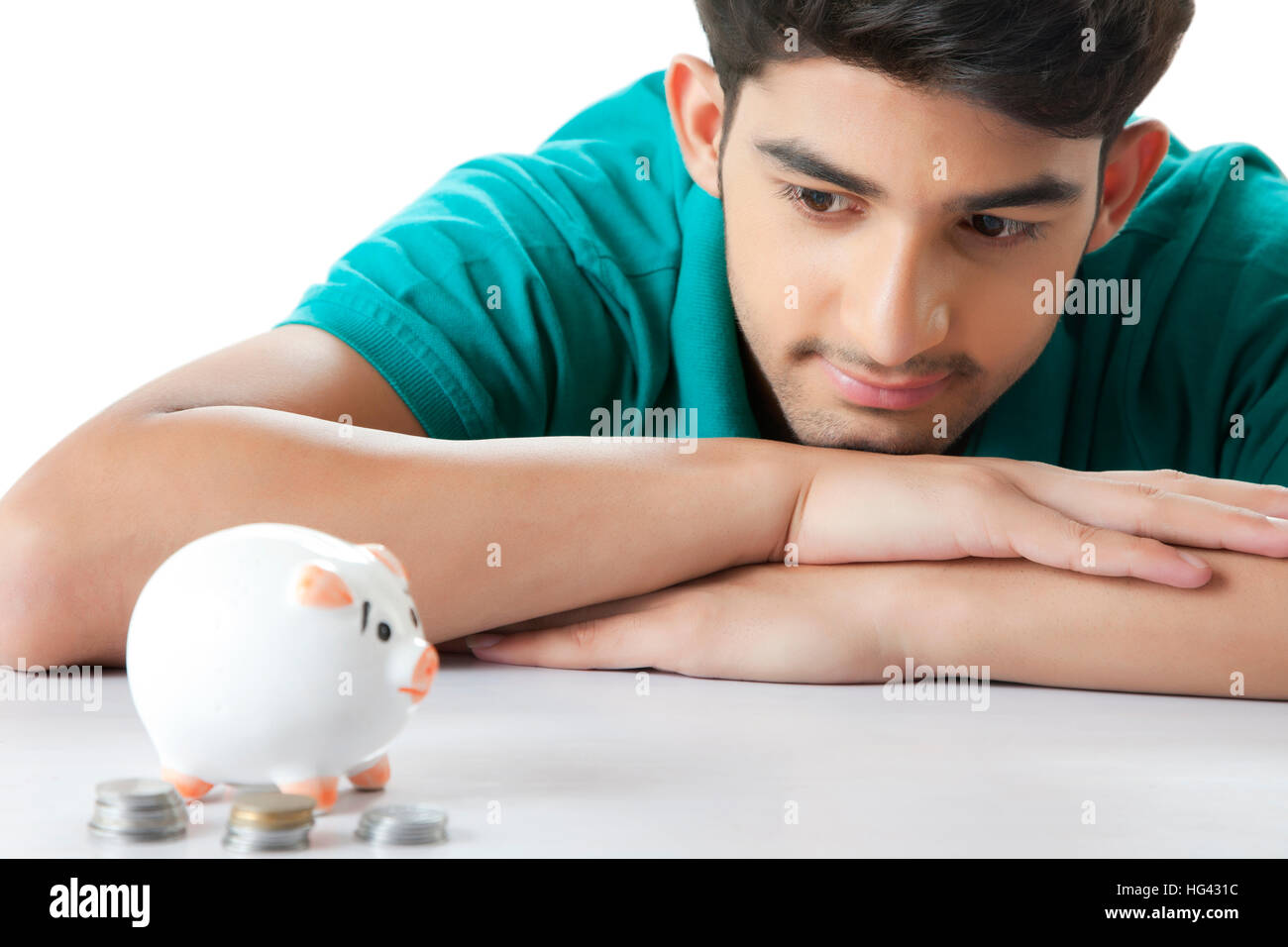 Young Men with heap of coins Stock Photo - Alamy