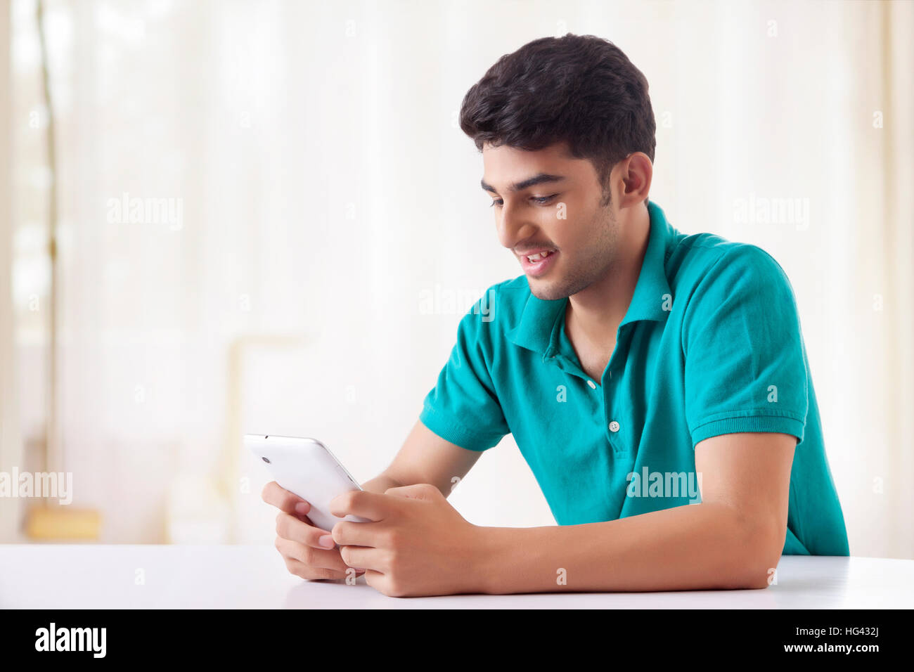 Student using Mobile Phones at the desk Stock Photo - Alamy