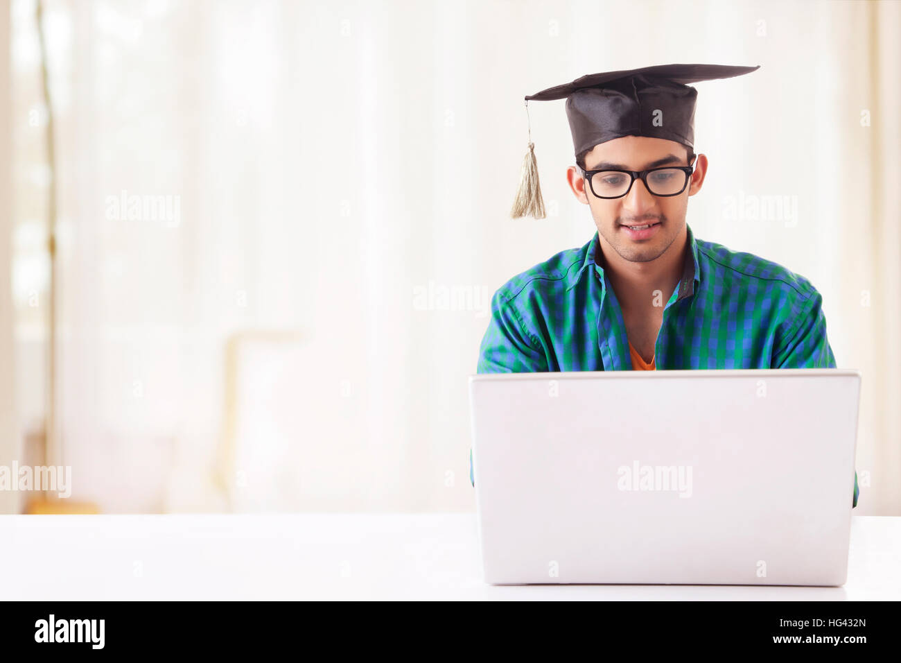 Young student using a laptop Stock Photo - Alamy